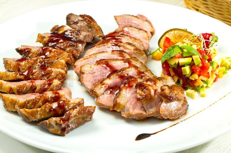 Roasted meat on the table in a ... | Stock image | Colourbox