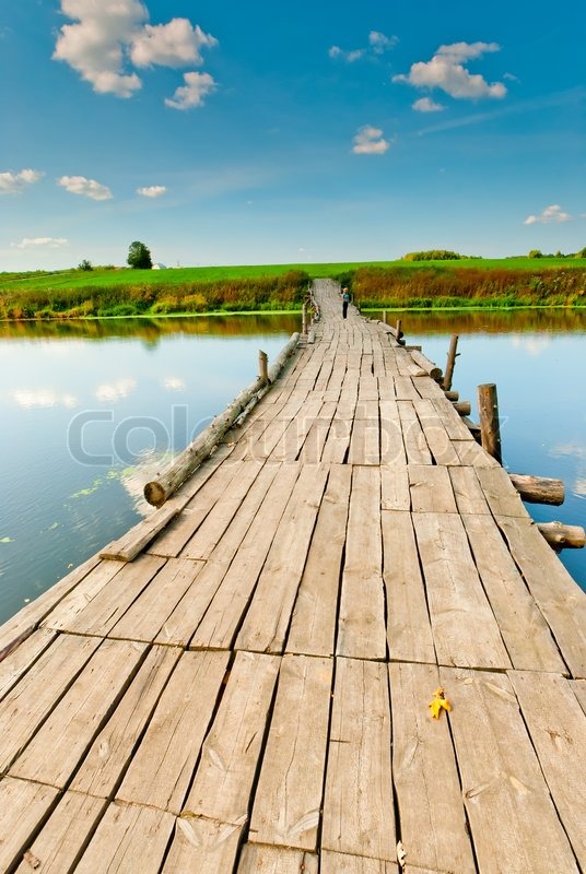 Wooden bridge over a small lake in the ... | Stock image | Colourbox