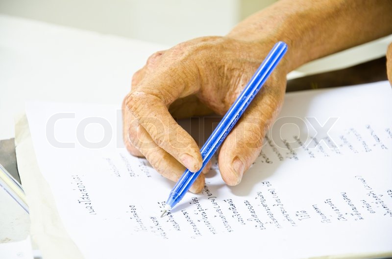 Hand of old man writing with pen | Stock image | Colourbox