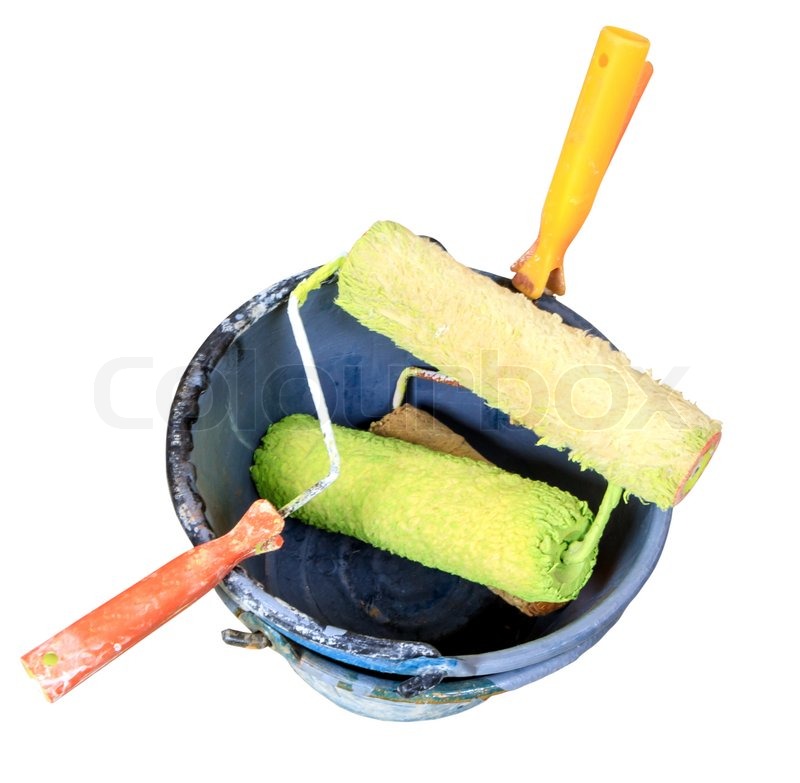 Colorful paint roller in paint bucket. | Stock image | Colourbox