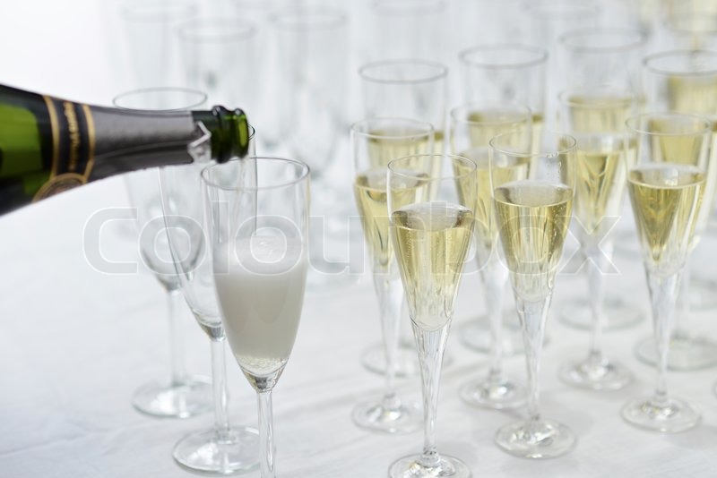 Serving champagne on celebration buffet | Stock image | Colourbox