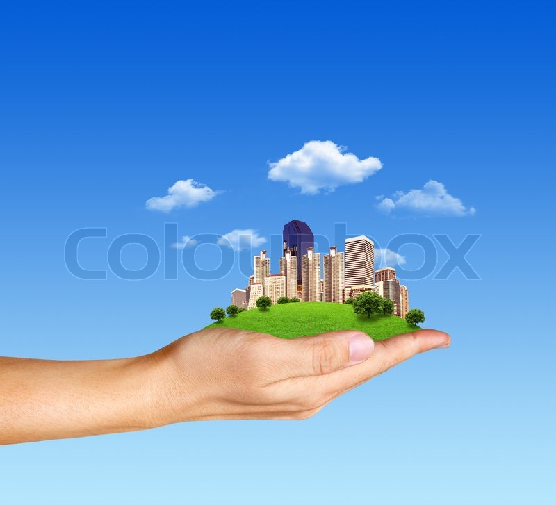 Concept human hand holding a city on ... | Stock image | Colourbox
