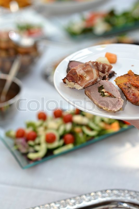 Buffet and plate with delicious food | Stock image | Colourbox
