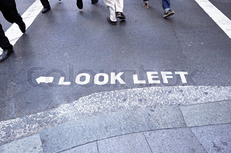 "LOOK LEFT" sign on the street in ... | Stock Photo | Colourbox