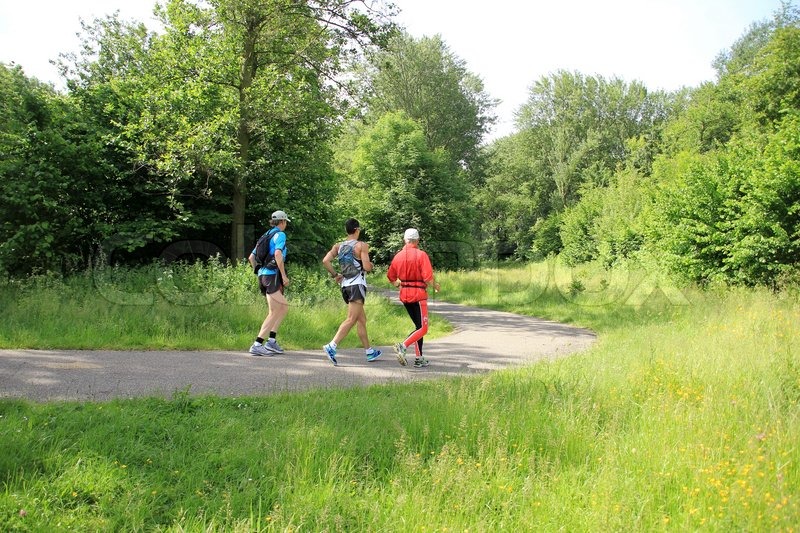 Three runners training for the marathon ... | Stock image | Colourbox