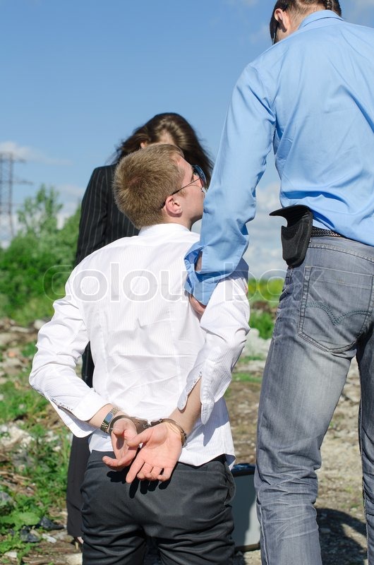 Two FBI agents conduct arrest of an ... | Stock image | Colourbox