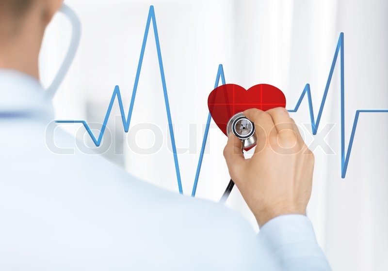 Doctor with stethoscope listening heart ... | Stock image | Colourbox