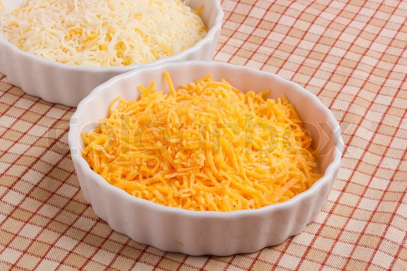 Two versions of the grated cheese in a ... | Stock image | Colourbox