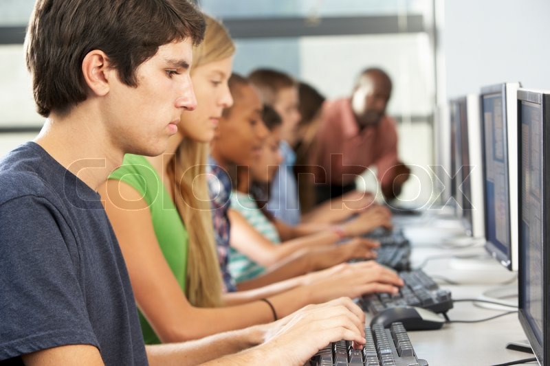 Group Of Students Working At Computers ... | Stock image | Colourbox