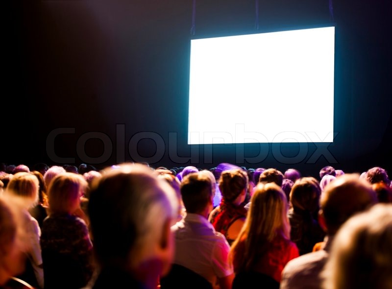 Crowd audience in dark looking at ... | Stock image | Colourbox