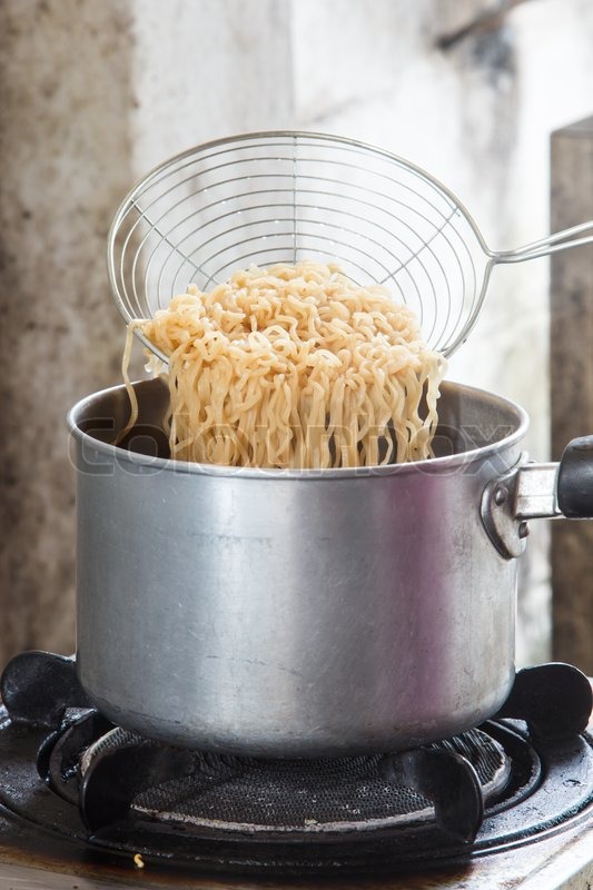 Boiling water with noodles in the steel ... | Stock image | Colourbox