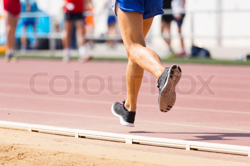Closeup of legs of a track runner | Stock image | Colourbox