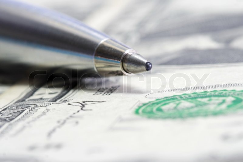 Ballpoint metal pen on US dollar bill | Stock image | Colourbox