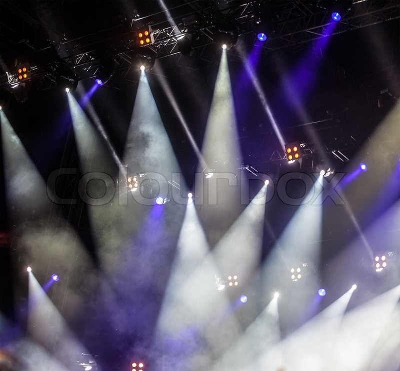 Cheering crowd in front of bright stage ... | Stock Photo | Colourbox