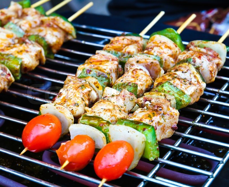 Sizzling barbecue sticks with meat and vegetables | Stock Photo | Colourbox
