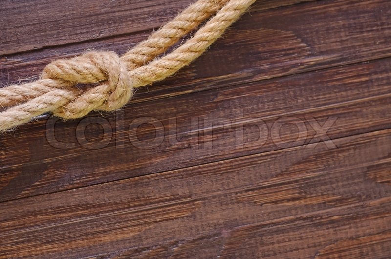 Rope on wooden background | Stock Photo | Colourbox