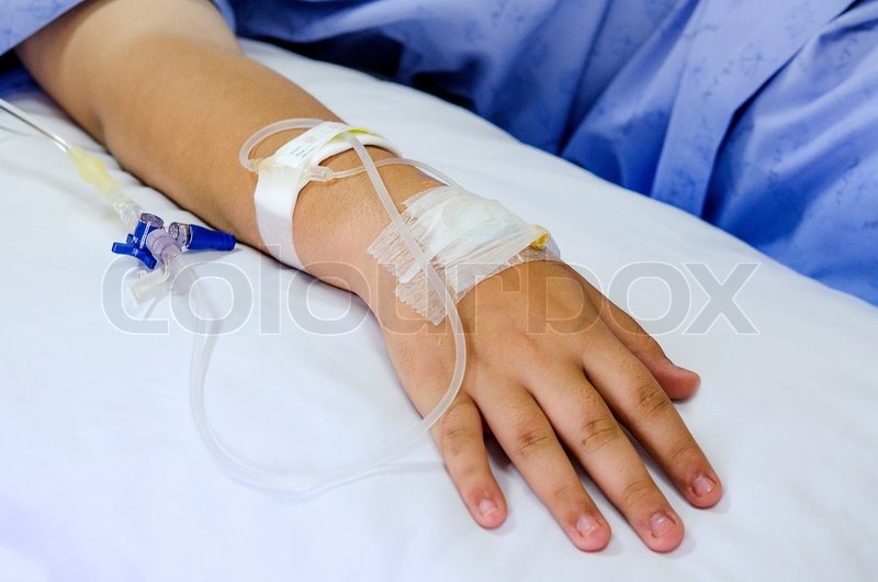 IV solution in patient hand | Stock image | Colourbox