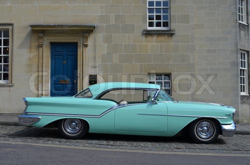 Light blue vintage car parked on a ... | Stock Photo | Colourbox