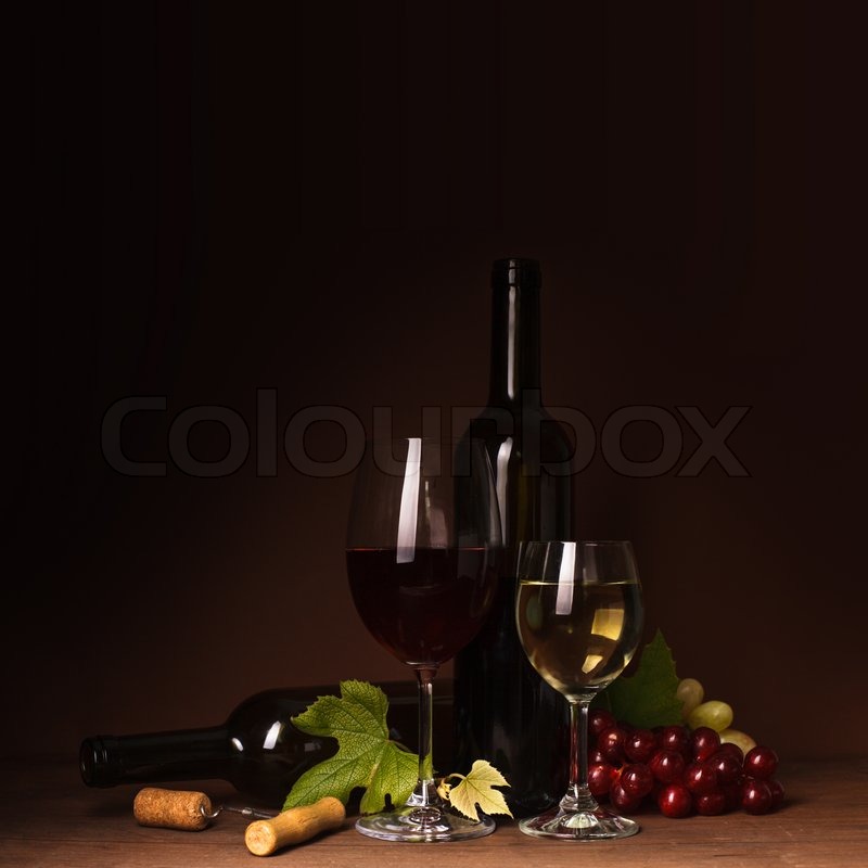 Wine still life: bottles, corks, grapes ... | Stock image | Colourbox