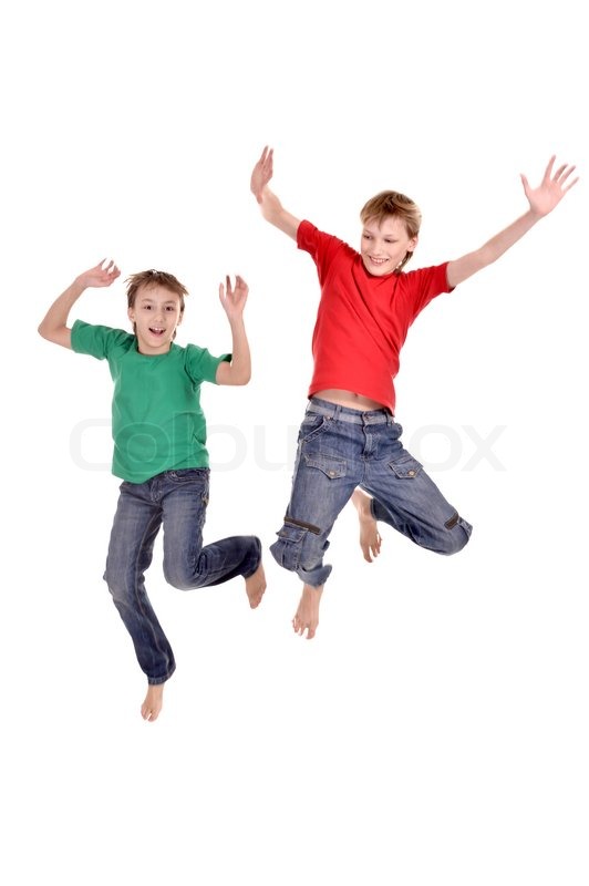 Two cheerful boys jumping on a white ... | Stock image | Colourbox