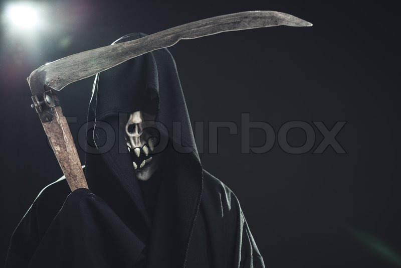 Death with scythe standing in the dark | Stock image | Colourbox