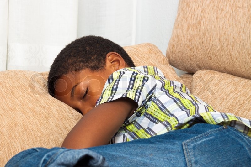 Close up of child boy sleeping on sofa. | Stock image | Colourbox