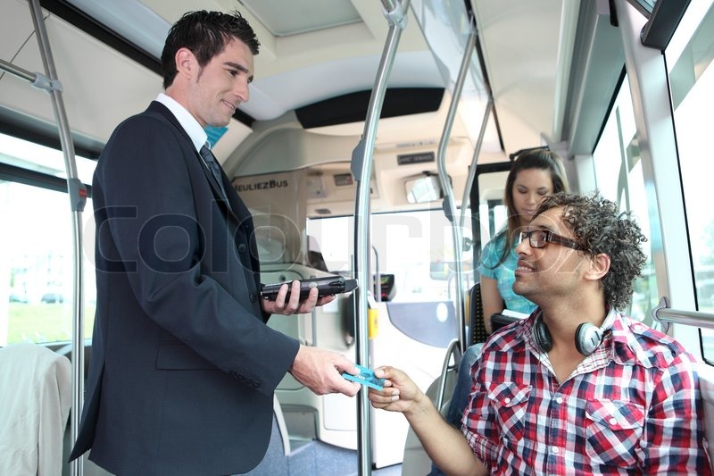 Controlling passengers in a bus. | Stock image | Colourbox