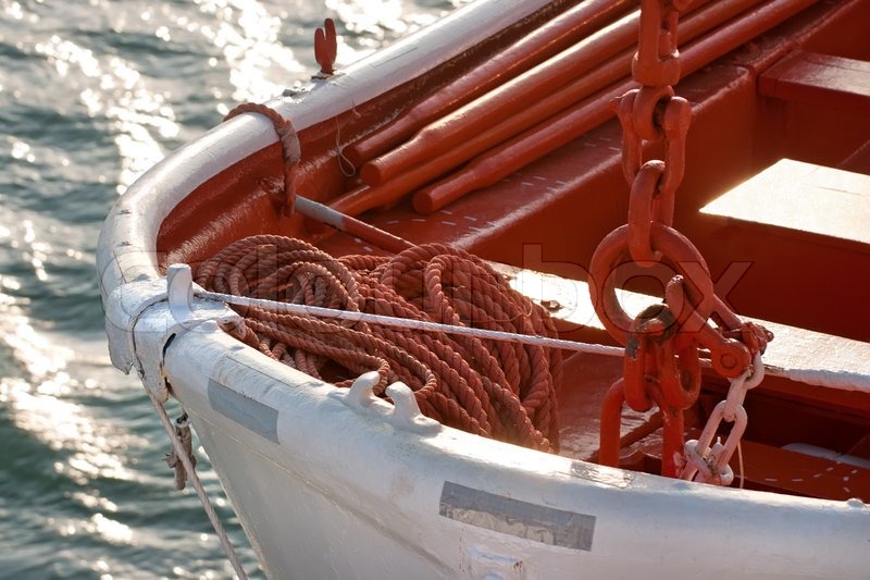 Closeup lifeboat with a rope on the sea | Stock image | Colourbox