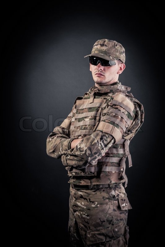 Military man on a black background | Stock image | Colourbox