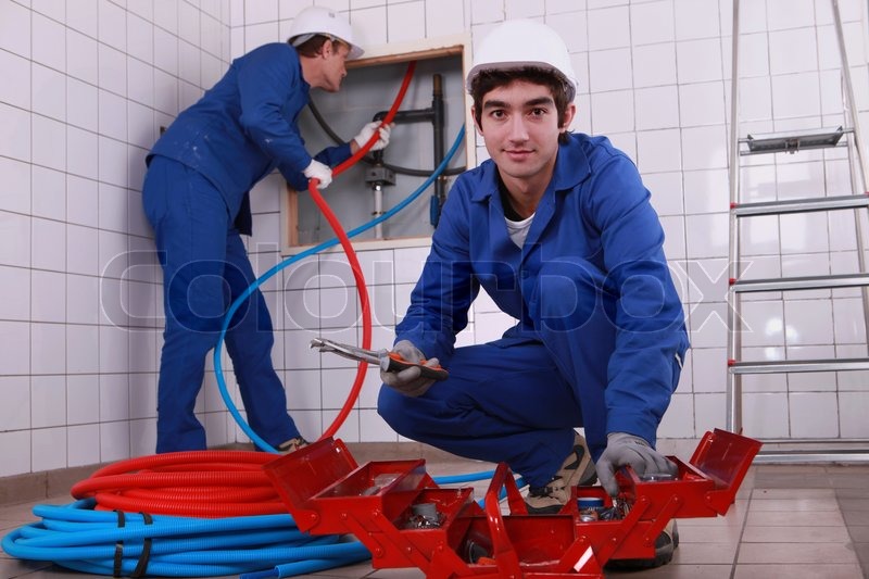 Plumbing team with a toolbox | Stock image | Colourbox