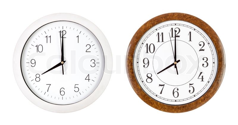 Two clock faces showing eight o'clock ... | Stock image | Colourbox