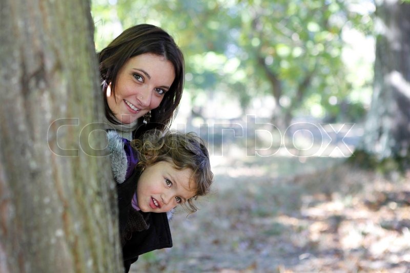 Child Hiding Behind Mother