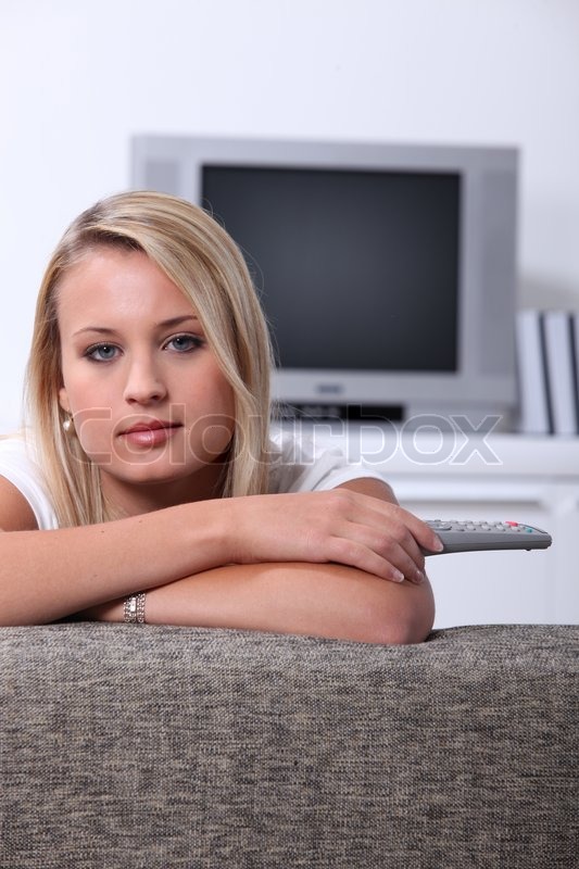 Girl watching television | Stock image | Colourbox