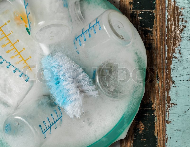 Bottle of milk are washing | Stock Photo | Colourbox