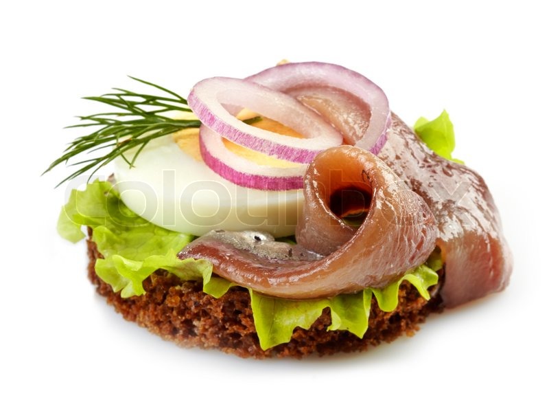 Canape with anchovy and egg on white ... | Stock image | Colourbox