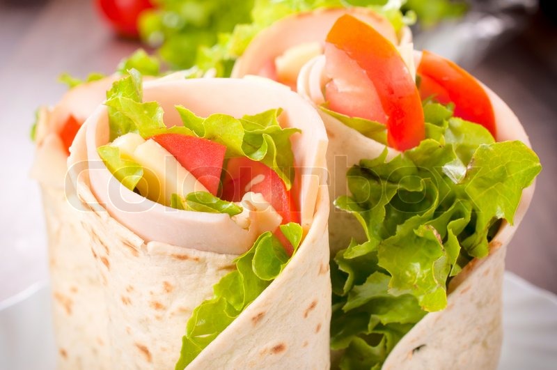 Tasty tortilla sandwich wrap with ... | Stock image | Colourbox
