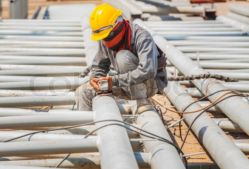 Sparks while worker grinding for repair ... | Stock image | Colourbox
