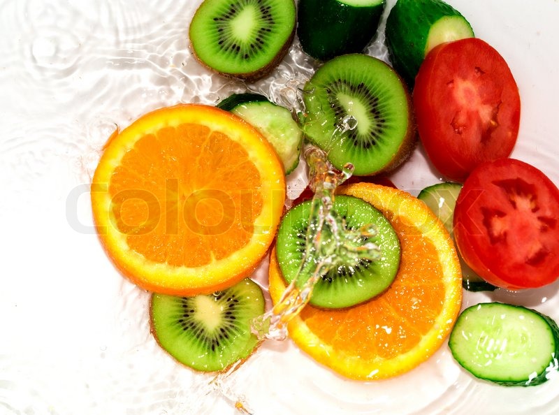 Fresh fruits and vegetables in water on ... | Stock image | Colourbox