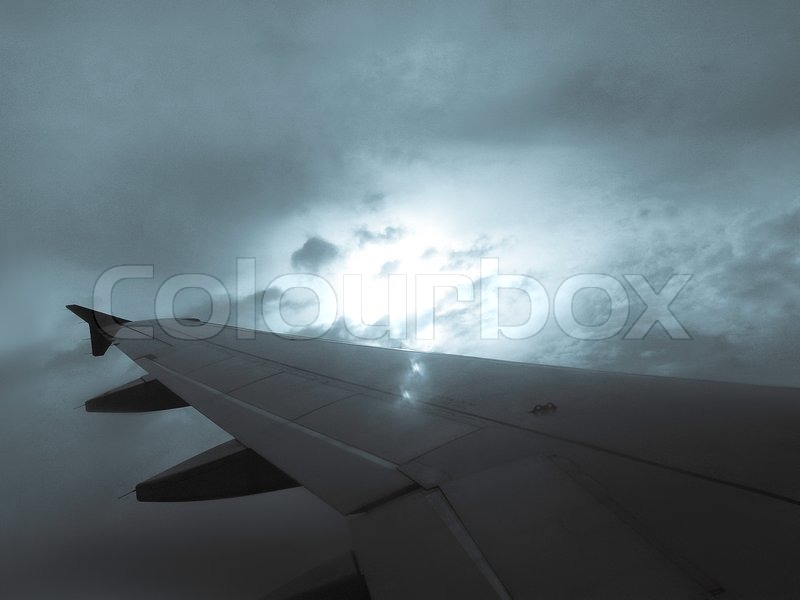Looking storm through window aircraft ... | Stock image | Colourbox