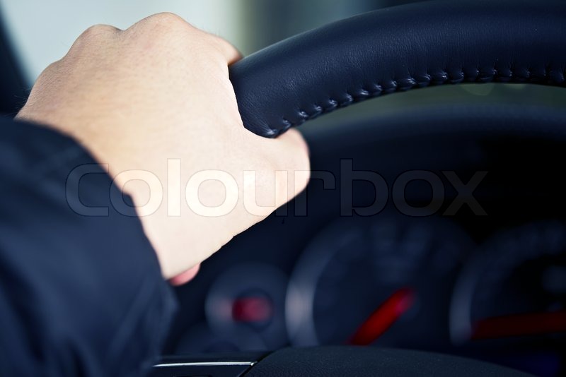 Men Left Hand on Car Steering Wheel. ... | Stock image | Colourbox