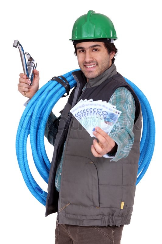 Plumber holding cash | Stock image | Colourbox