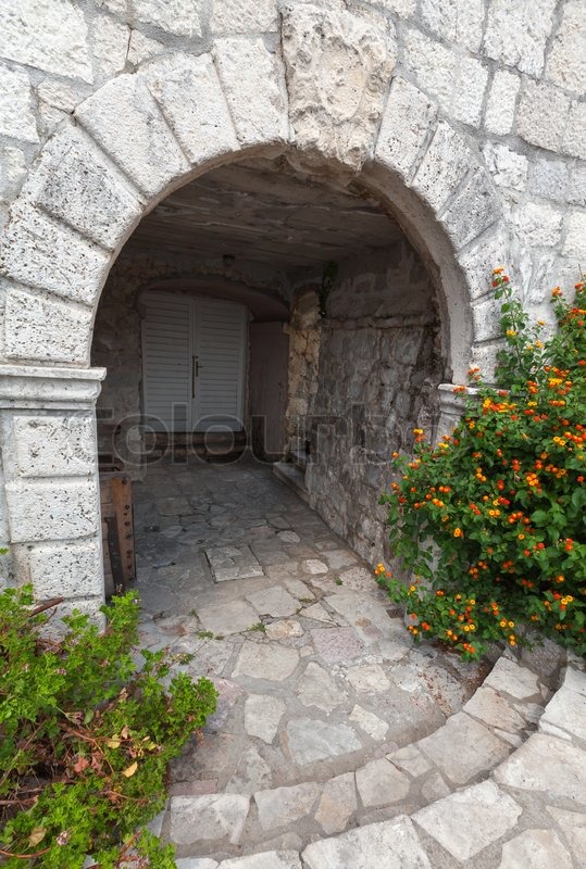 Stone arch, entrance to ancient house ... | Stock image | Colourbox