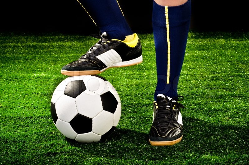 Soccer player feet with ball closeup | Stock image | Colourbox