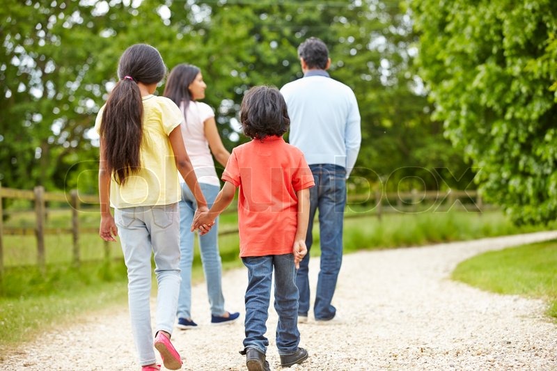Indian Family Walking In Countryside | Stock image | Colourbox