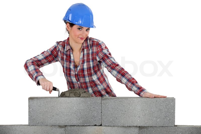 Woman building wall | Stock image | Colourbox