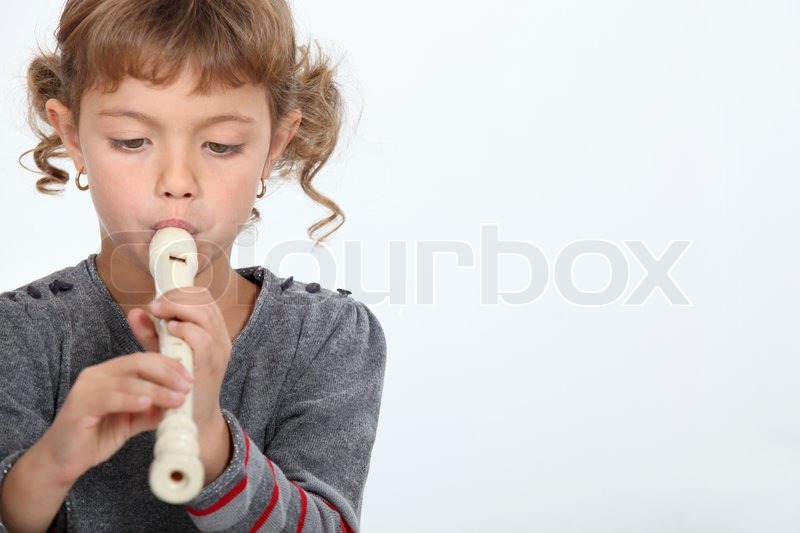 Girl playing a recorder | Stock image | Colourbox