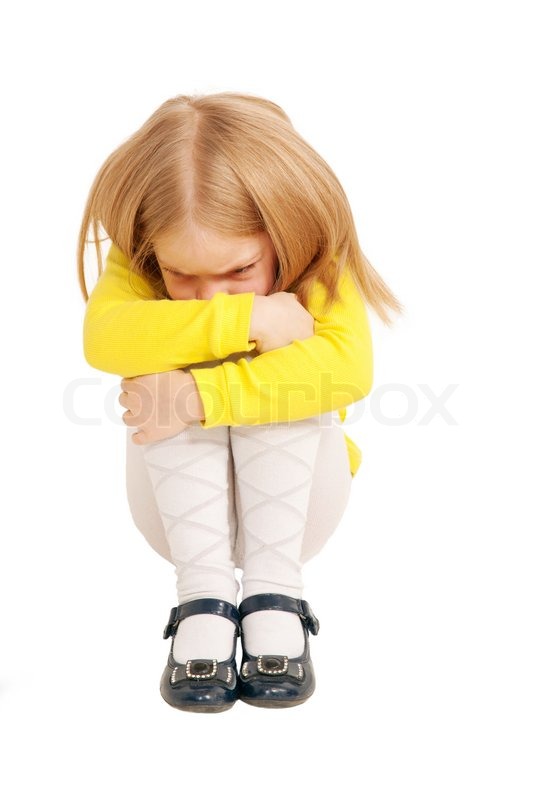 Little sad and upset child sitting hunched up into a ball. Isolated on ...