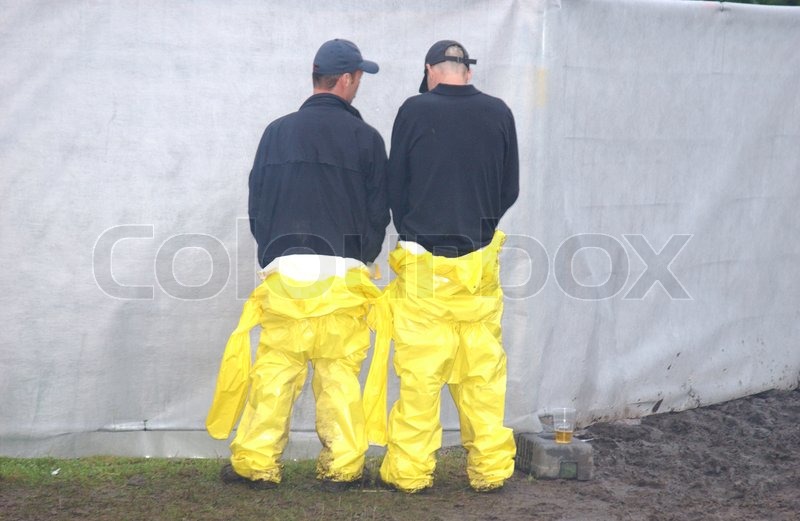 Back of two construction workers peeing | Stock image | Colourbox