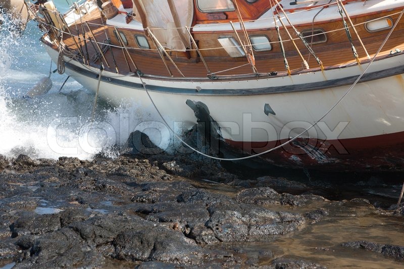 Yacht crash on the rocks after stormy ... | Stock image | Colourbox