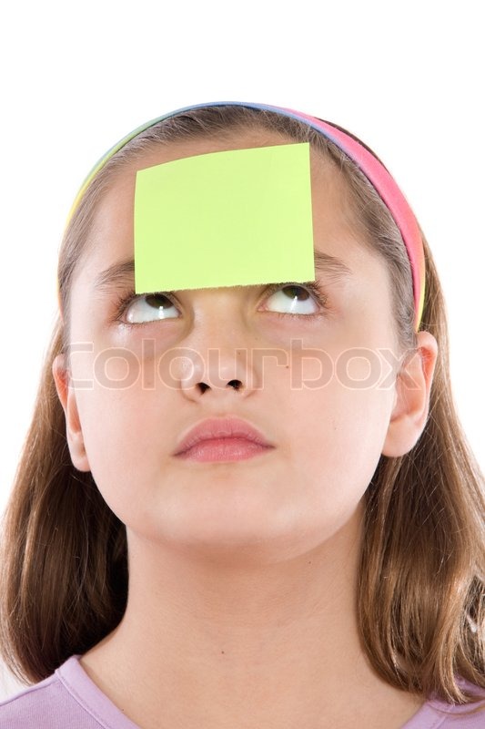 Adorable girl with a paper in her front ... | Stock image | Colourbox